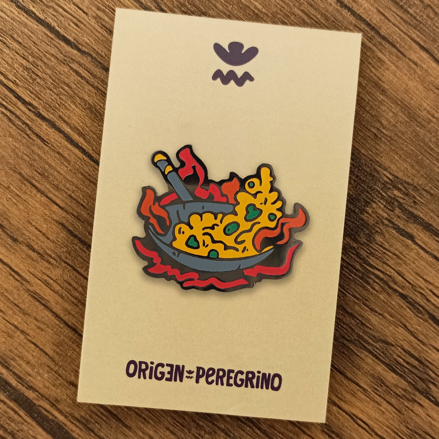 Pin Wok chifero – Origen Peregrino